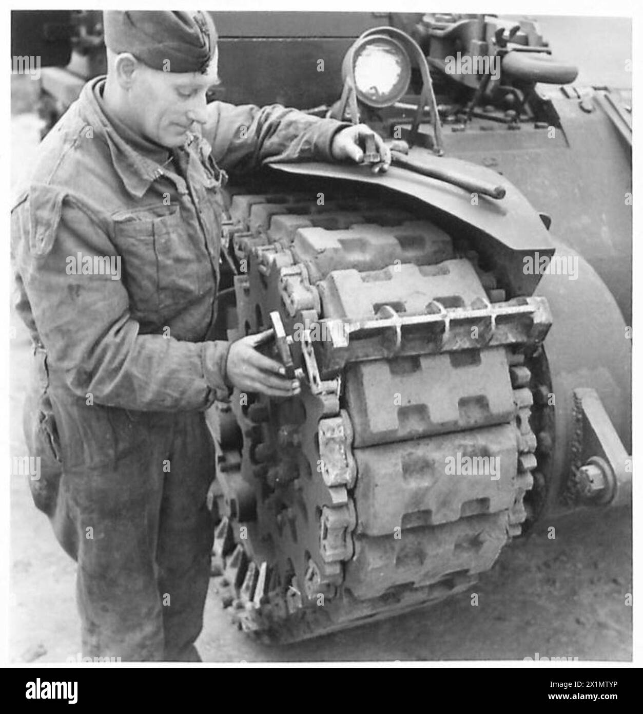 GENERAL GRANT TANK - Stages of connecting track grouser, twelve on each track to increase ...