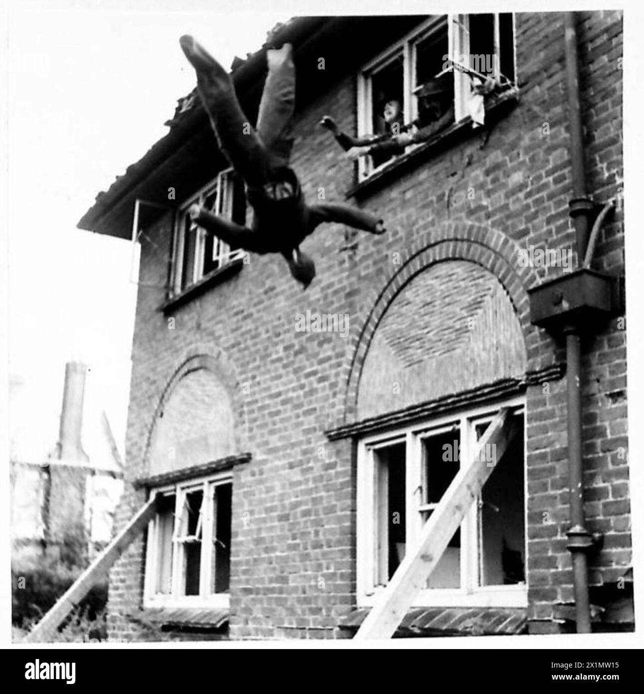 At a battle school demonstration, a dummy figure falls during street ...