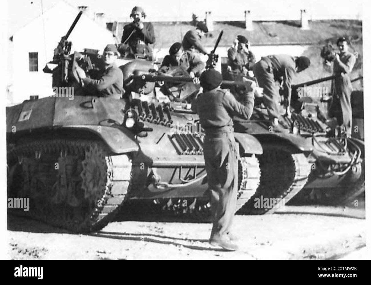 Yugoslav partisans cleaning a machine gun mounted on their Honey ...