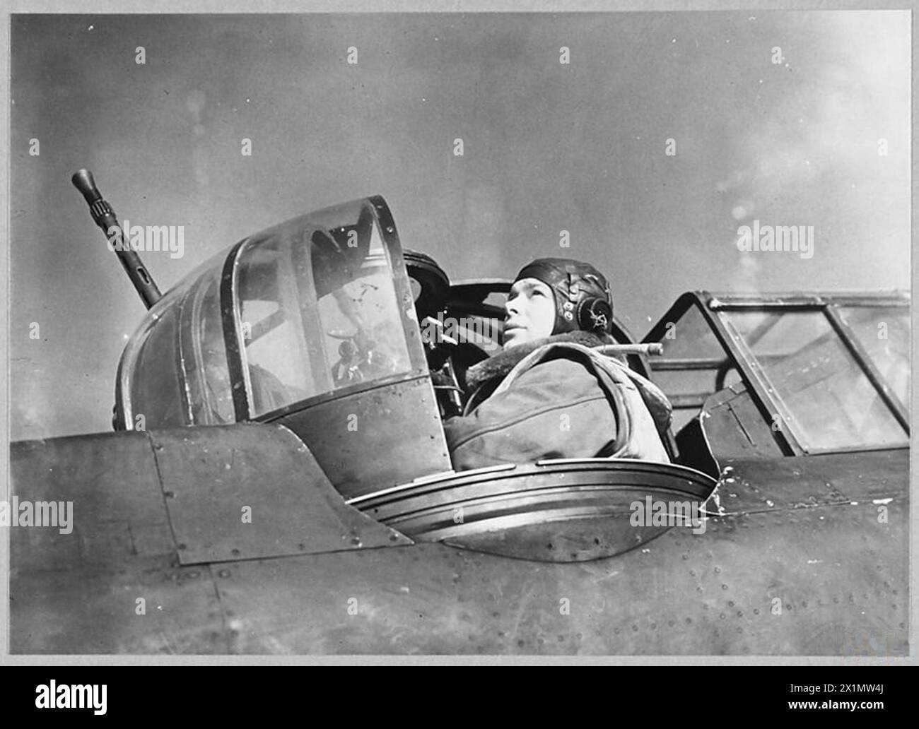 An RAF cadet trains as an air gunner in the turret of a Defiant ...