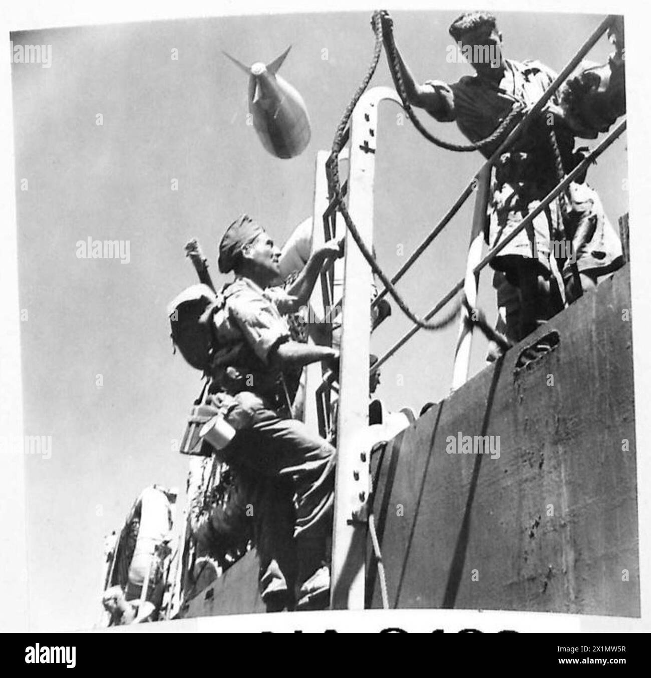 NORTH AFRICA : INVASION PREPARATIONS - Troops climbing aboard an L.S.T ...