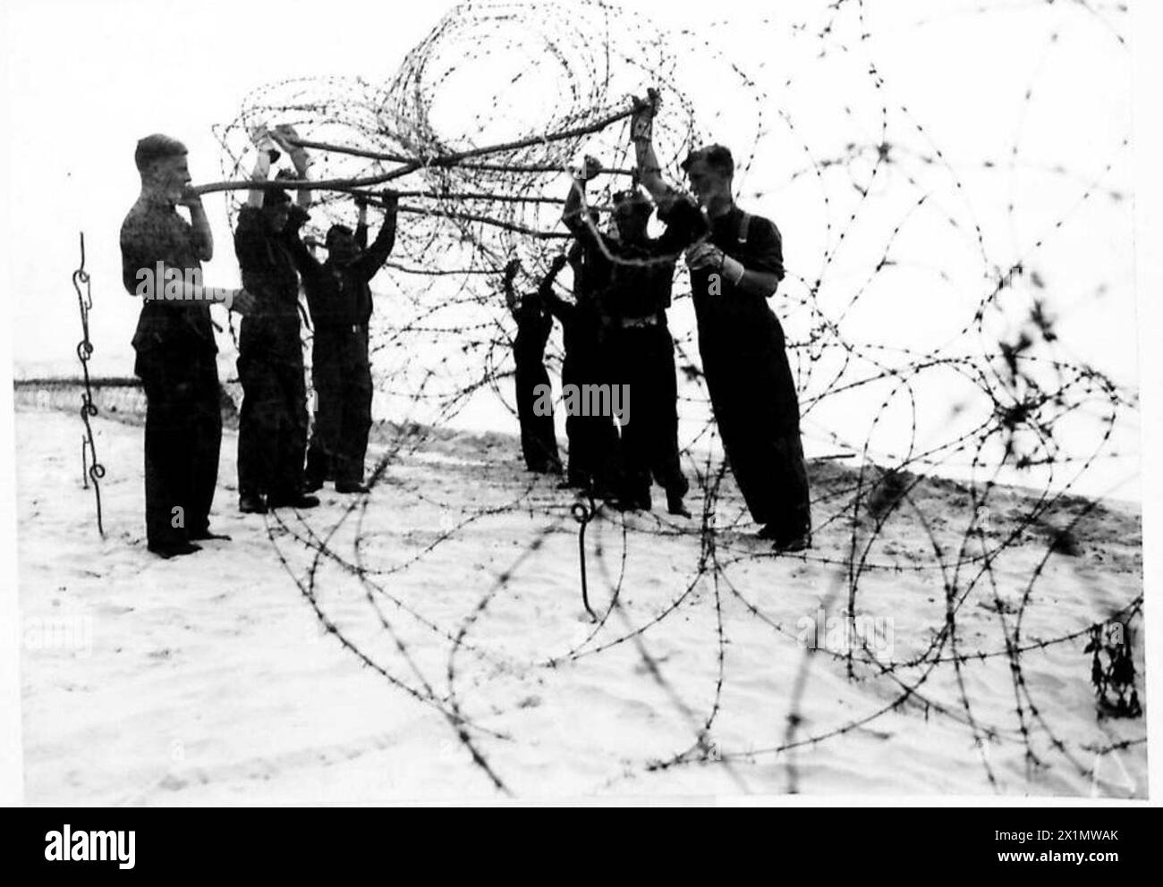 GREEN HOWARDS ON GUARD! - Troops placing barbed wire in fron of their ...