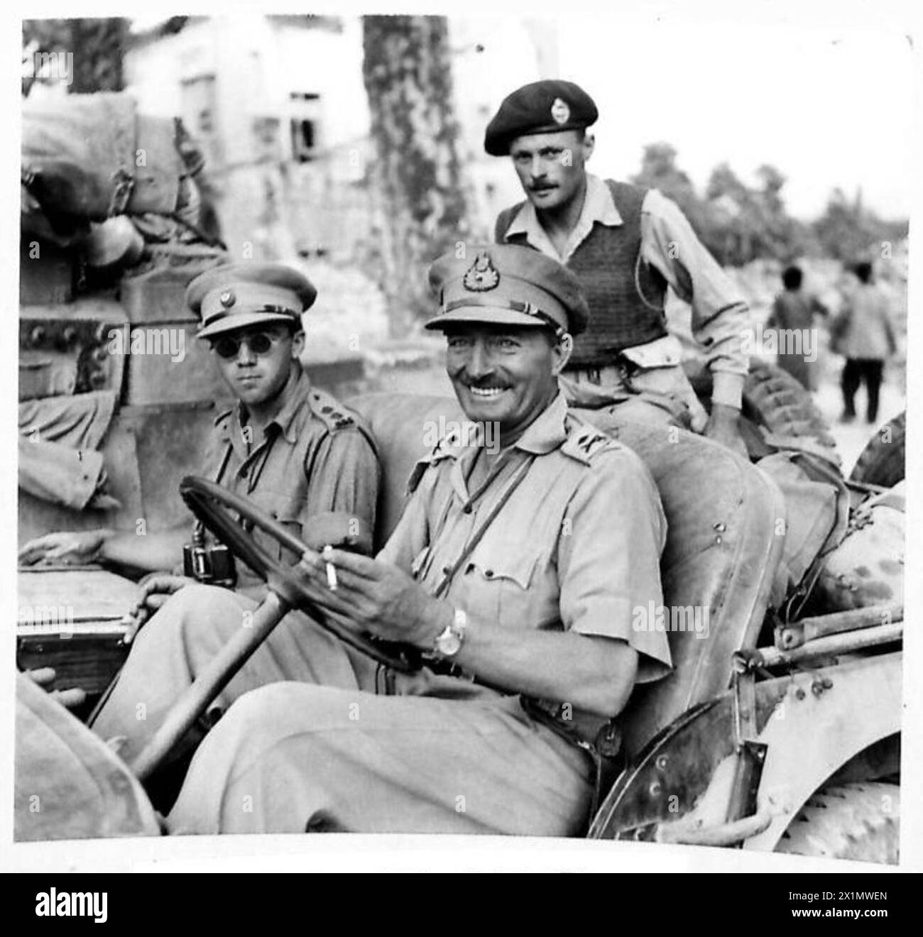 General Erskine of the British 7th Armoured Division observing troops ...