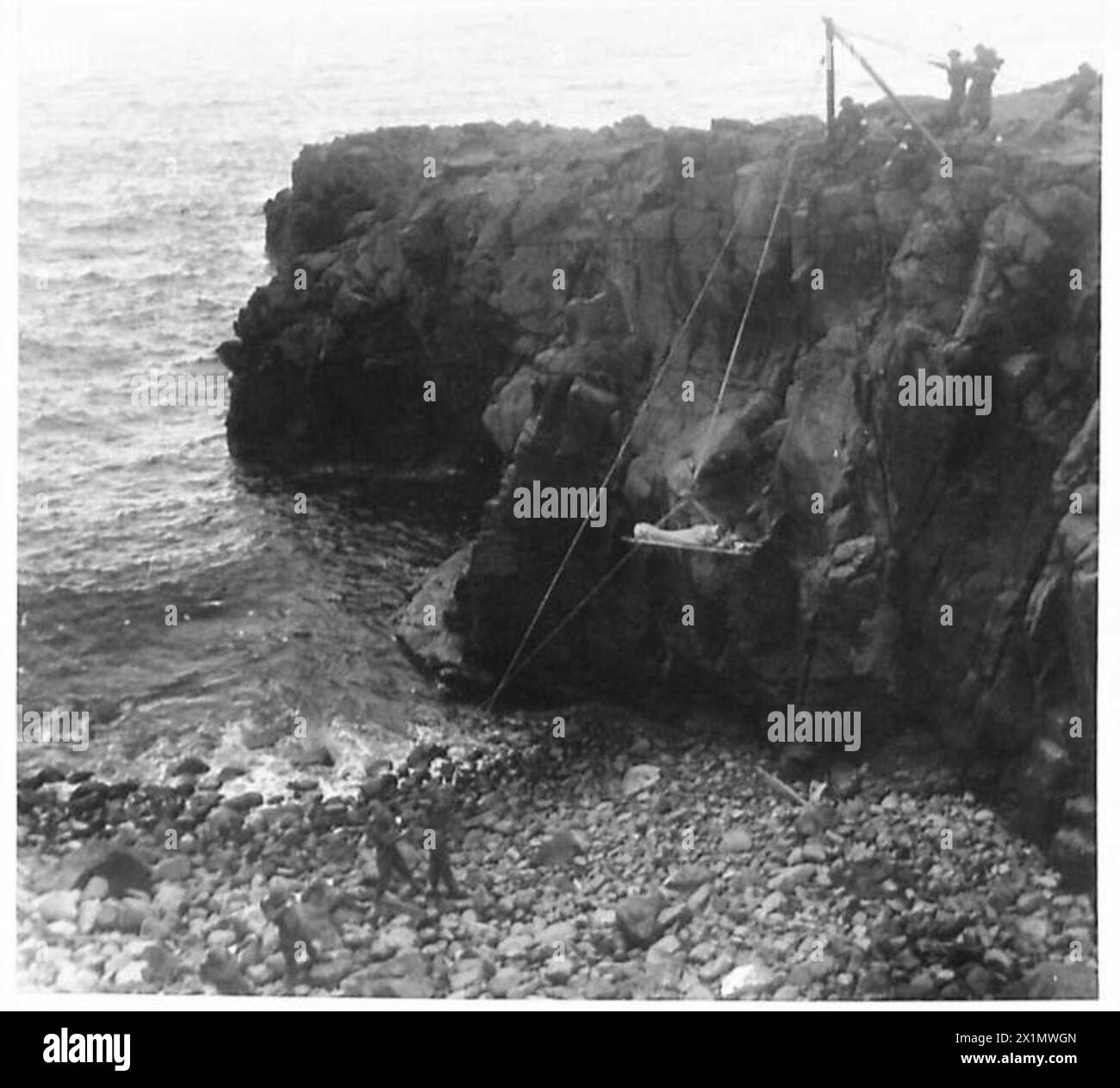 NEW METHOD OF RESCUING CLIFF CASUALTIES - From the shore, men of the ...