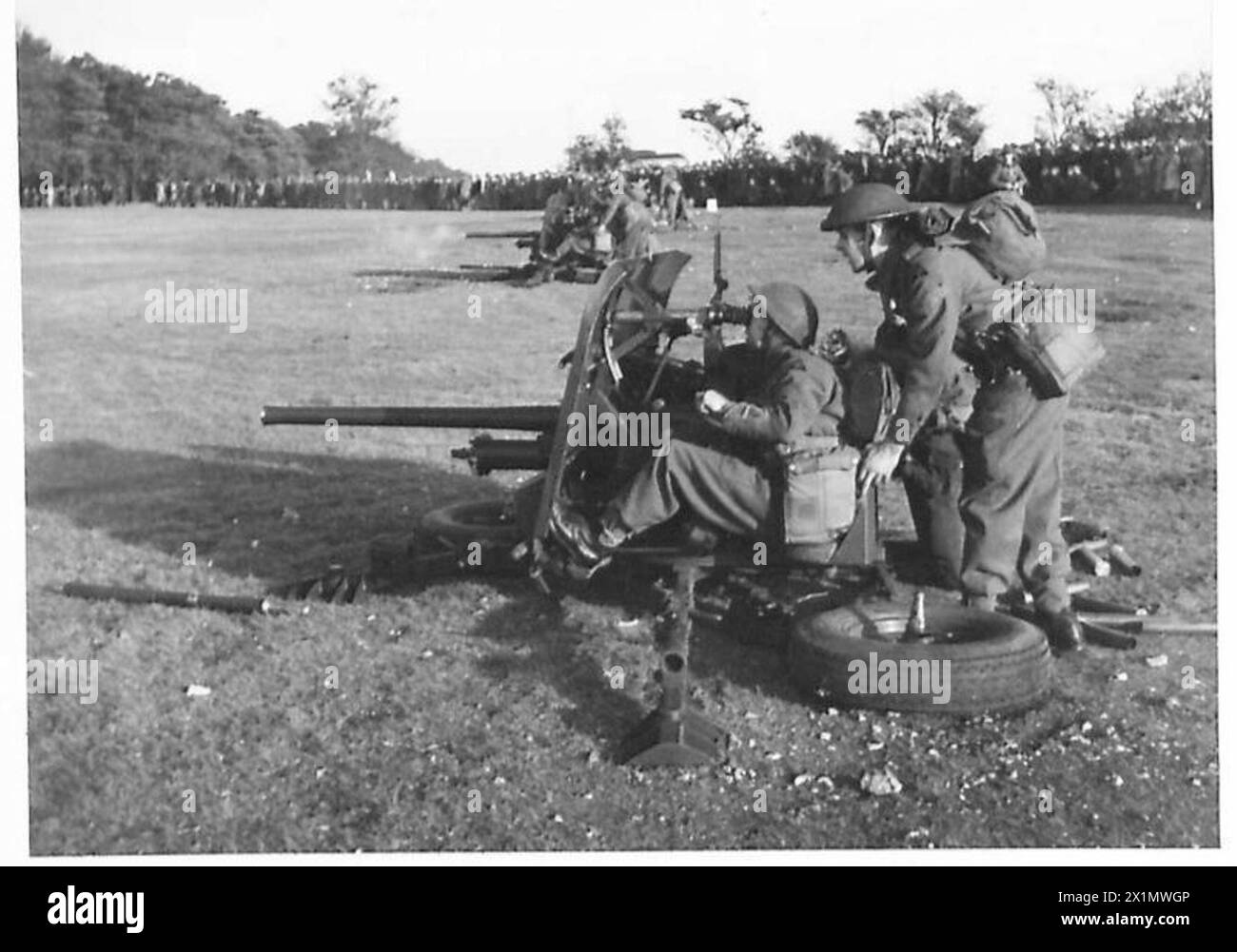 A demonstration of 2-pounder anti-tank guns is conducted under British ...
