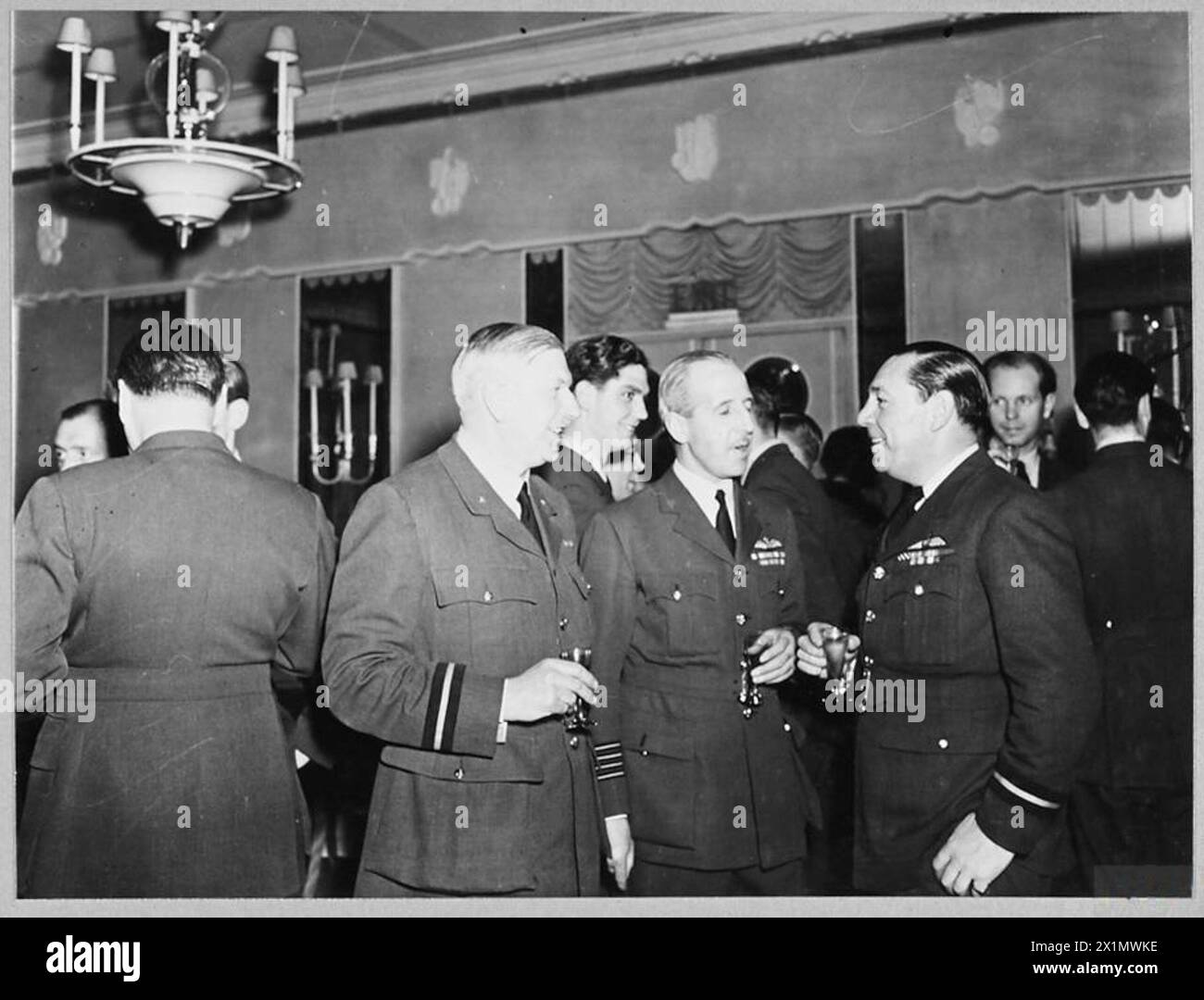 RAF Auxiliary Squadron members attend a reunion dinner in 1944, with ...