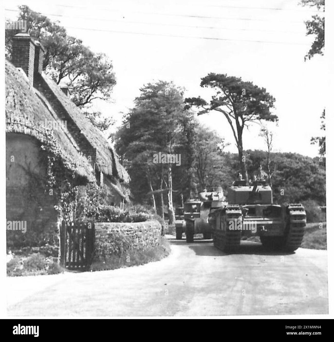 ANCIENT AND MODERN - Churchill Mk.III tank, followed by General Grant ...