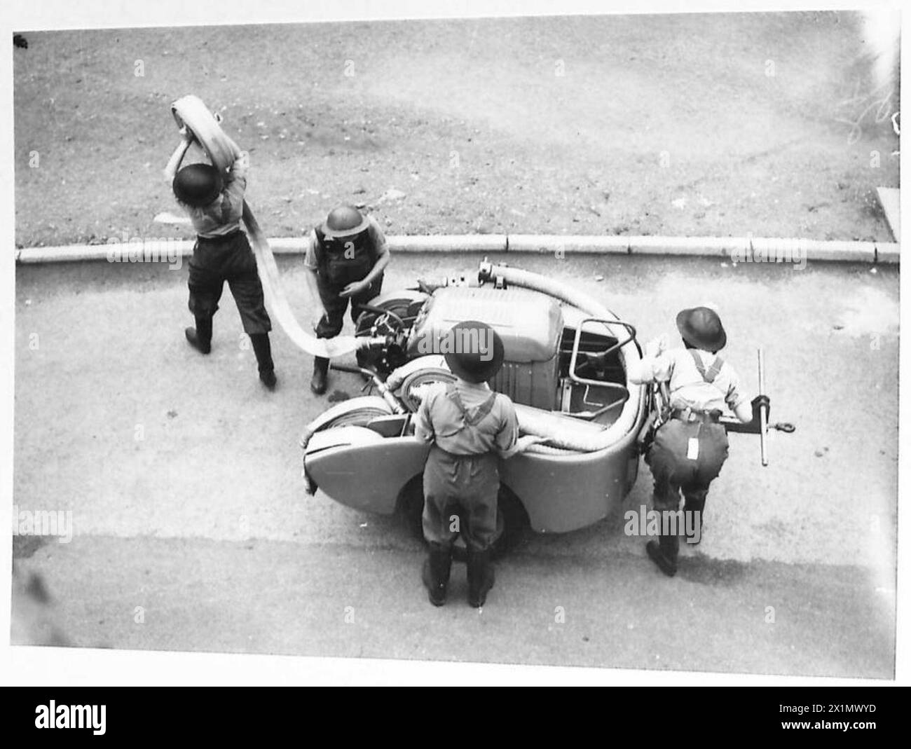 AT AN A.T.S. TRAINING CENTRE - ATS Fire Squad running out hose ...