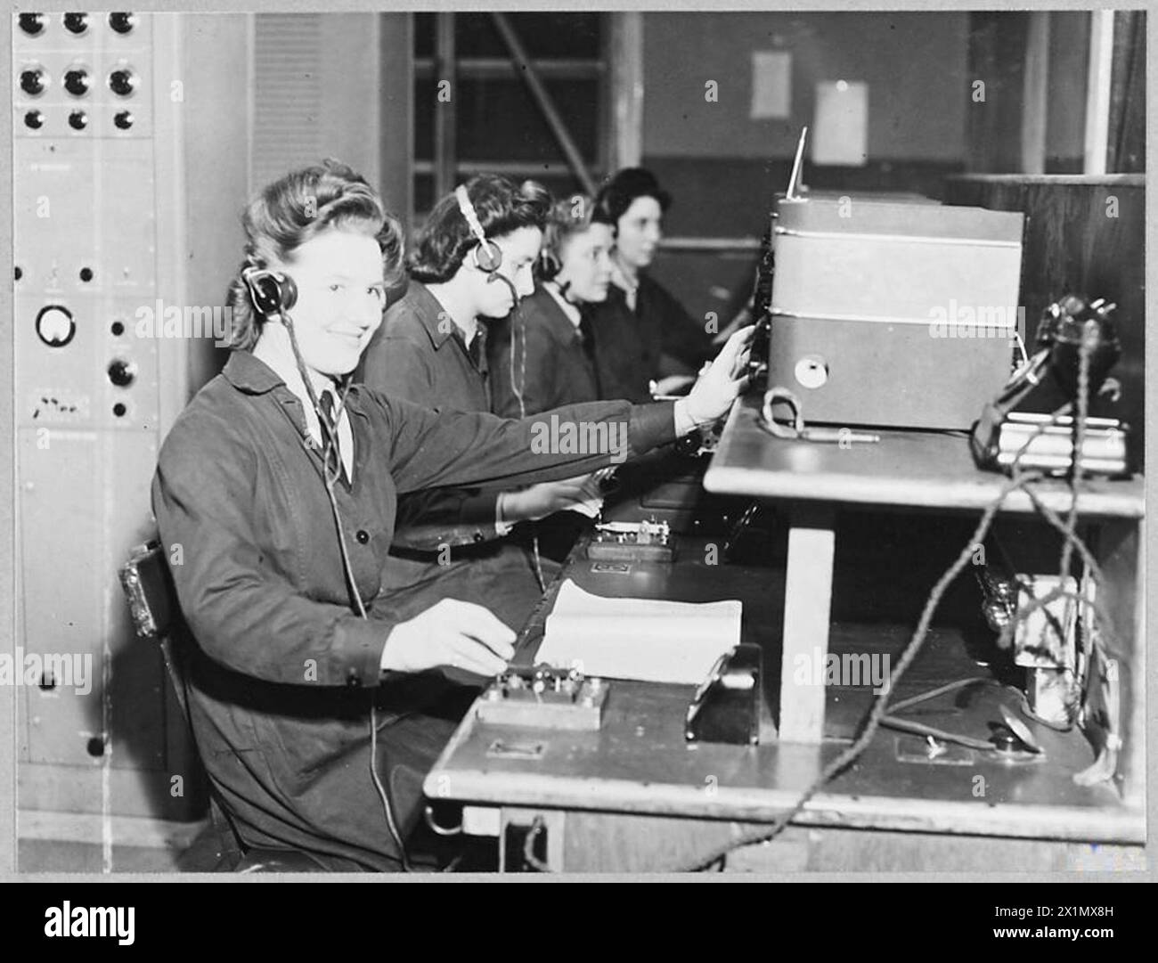 WAAF signals operators work in an RAF station signals centre, including ...