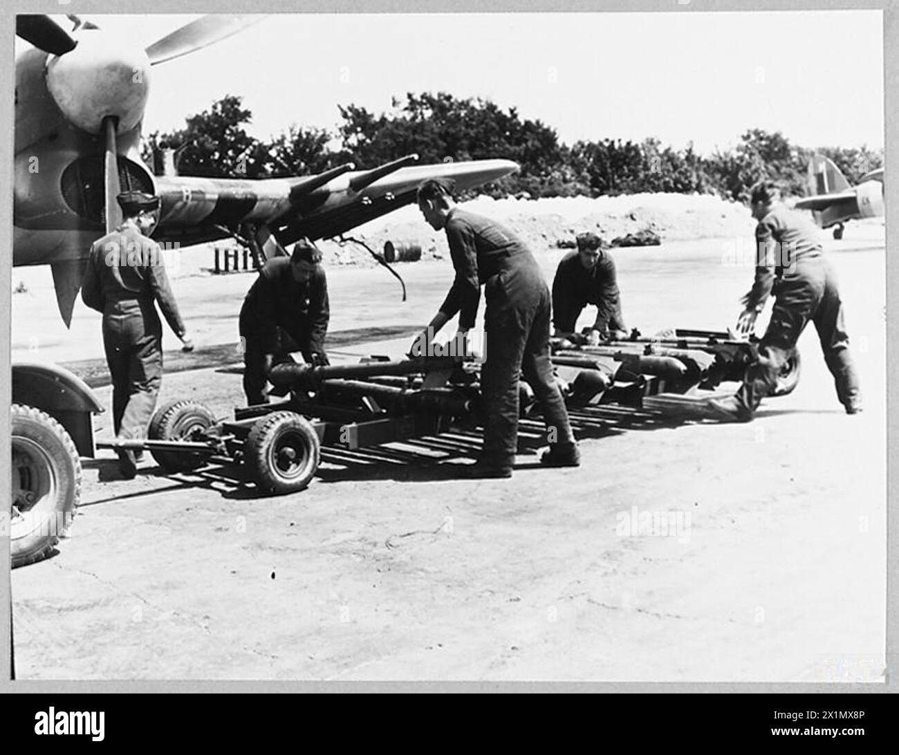 In 1944, bomb trolleys carrying rocket projectiles are delivered to ...