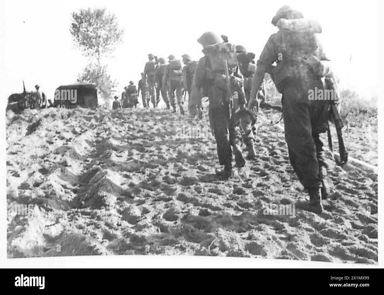 British troops of the Fifth Army move inland from the beaches at ...