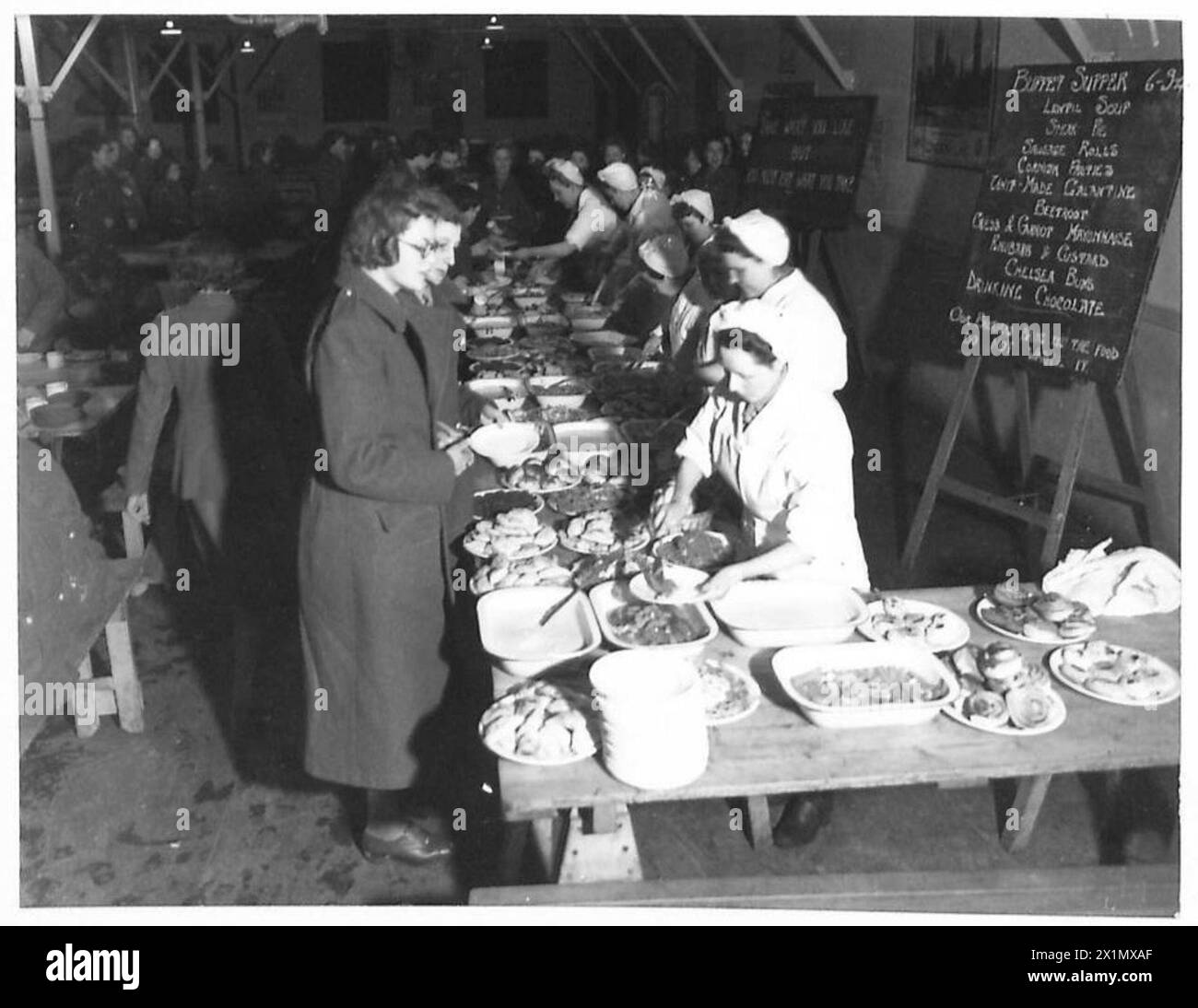 "TAKE WHAT YOU LIKE - BUT EAT IT" - Supper being served at the buffet ...