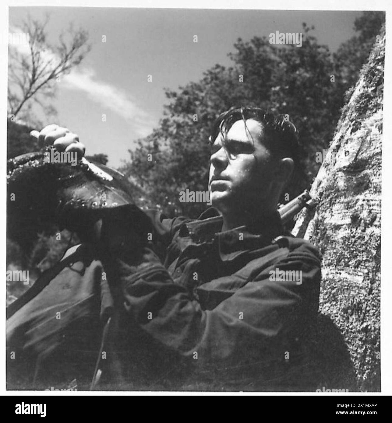TOUGHENING A SOLDIER - Scraping the mud from his boots, British Army ...