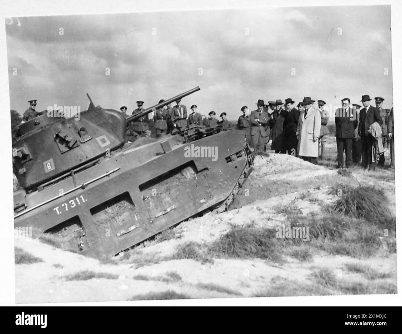 Major General Wesson inspects a Matilda Mark IIA PIP tank navigating ...