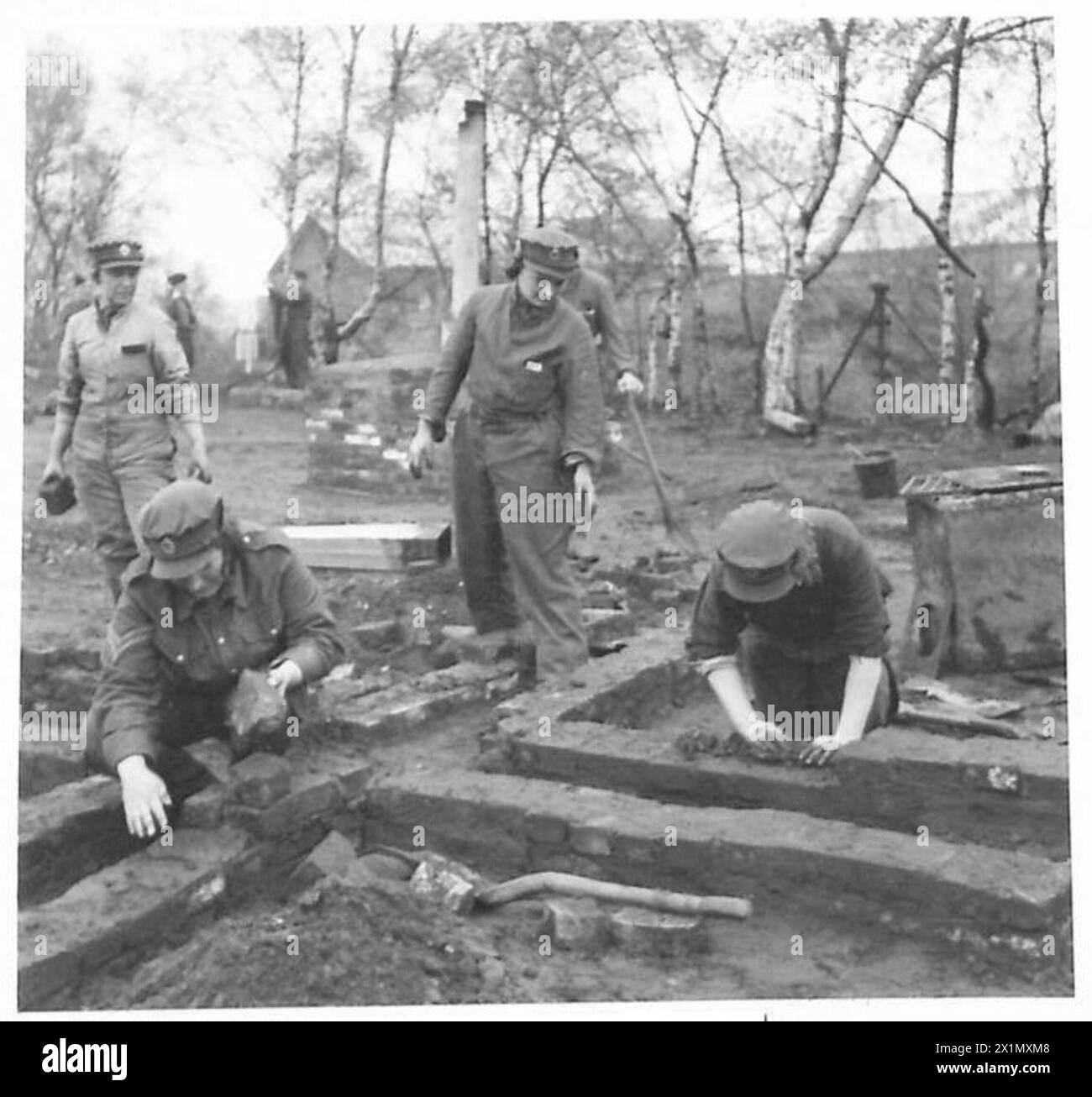 AT AN A.T.S. SCHOOL OF COOKERY - A.T.S. constructing a field oven. It ...