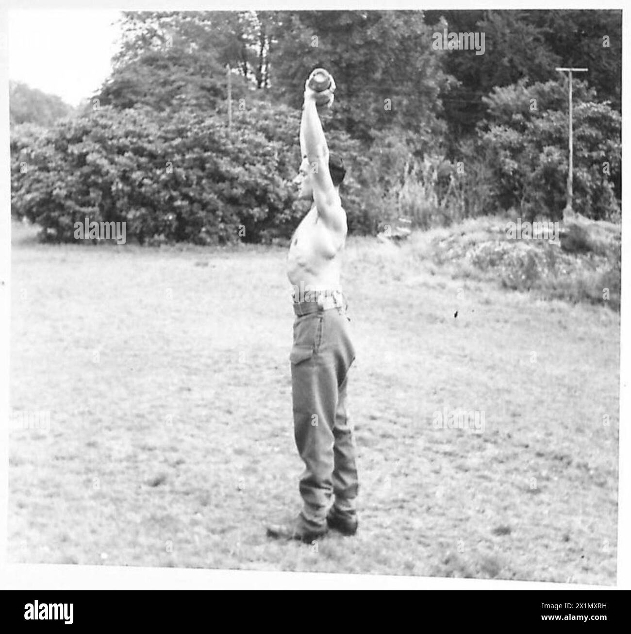 A gunner performs physical training exercises as part of British Army ...