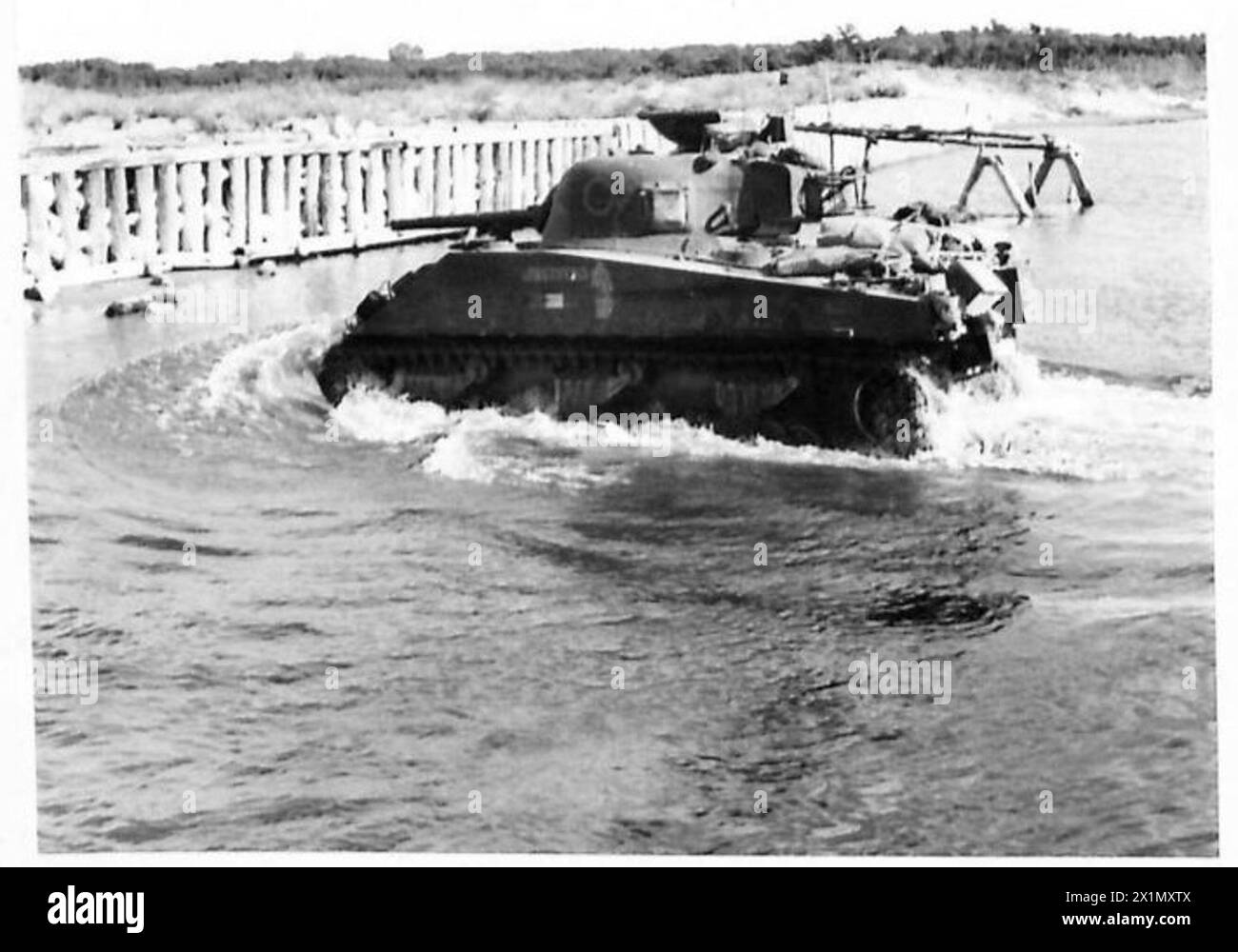 Sherman tanks of the Fifth Army ford a river in Italy, advancing in ...