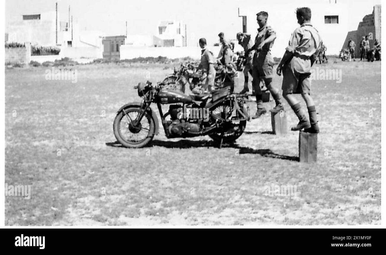 MOTOR CYCLE GYMKHANA - Competitors taking part in the balancing race ...