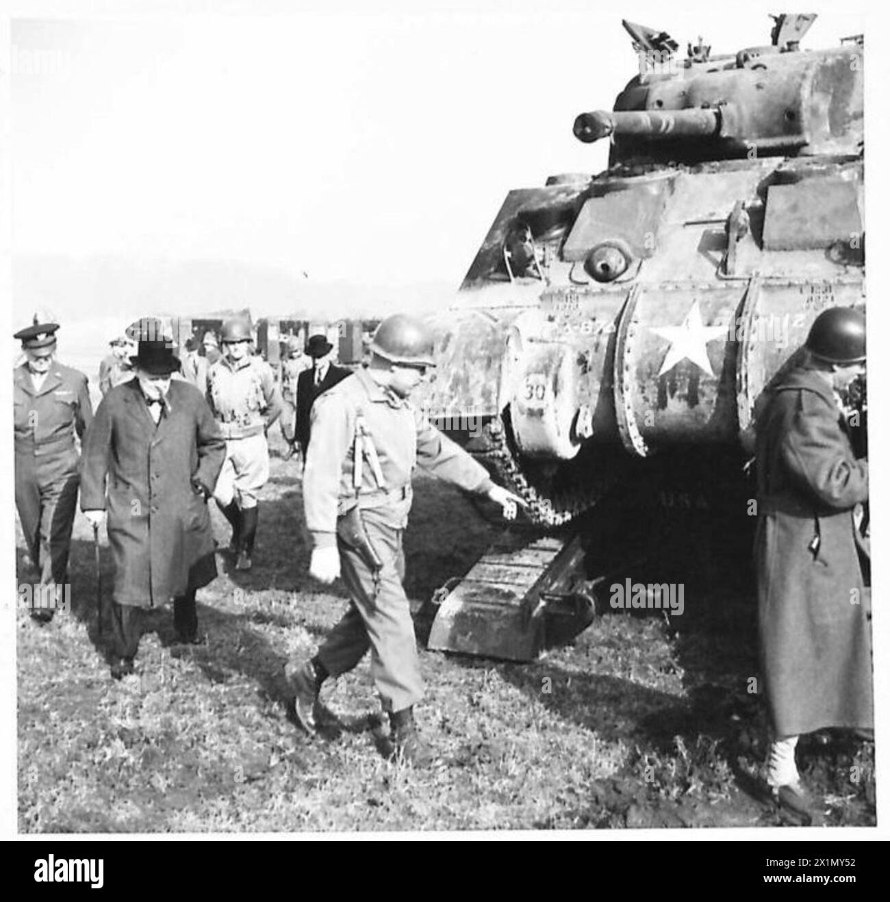 The Prime Minister and General Eisenhower inspect a tank recovery unit ...