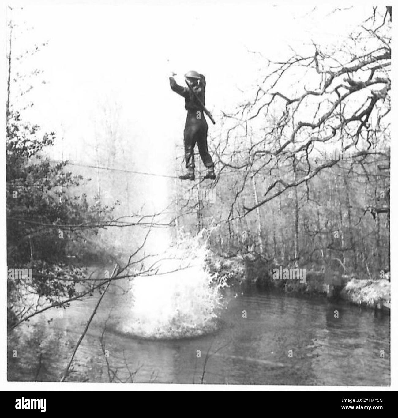 SCHOOL OF BATTLE DRILL - Crossing the river by a wire bridge, with high ...