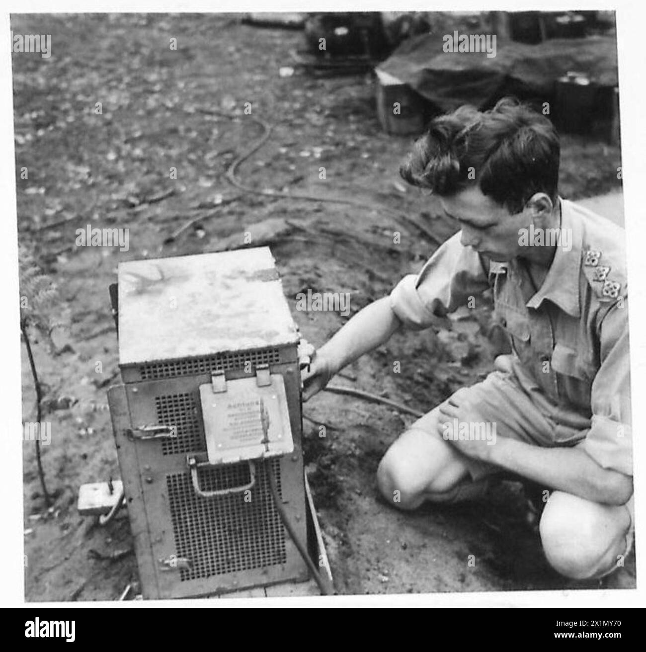 Captain Howells operates a German rectifier for battery charging in the ...