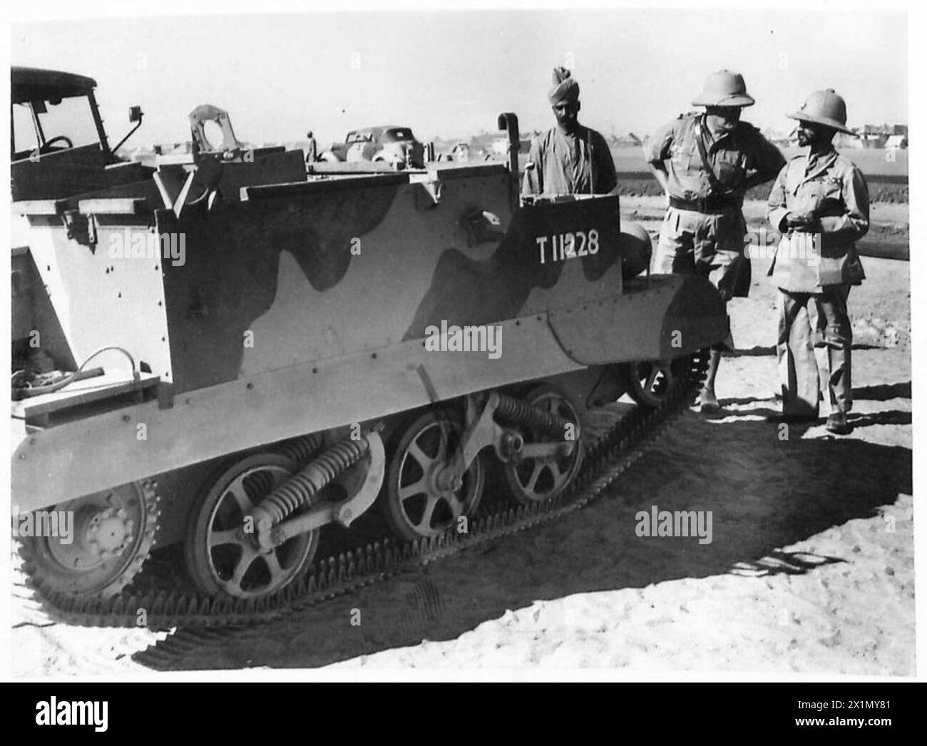EMPEROR OF ABYSSINIA SEES HIS FIRST BATTALION OFF - The Emperor inspecting a Bren gun carrier ...