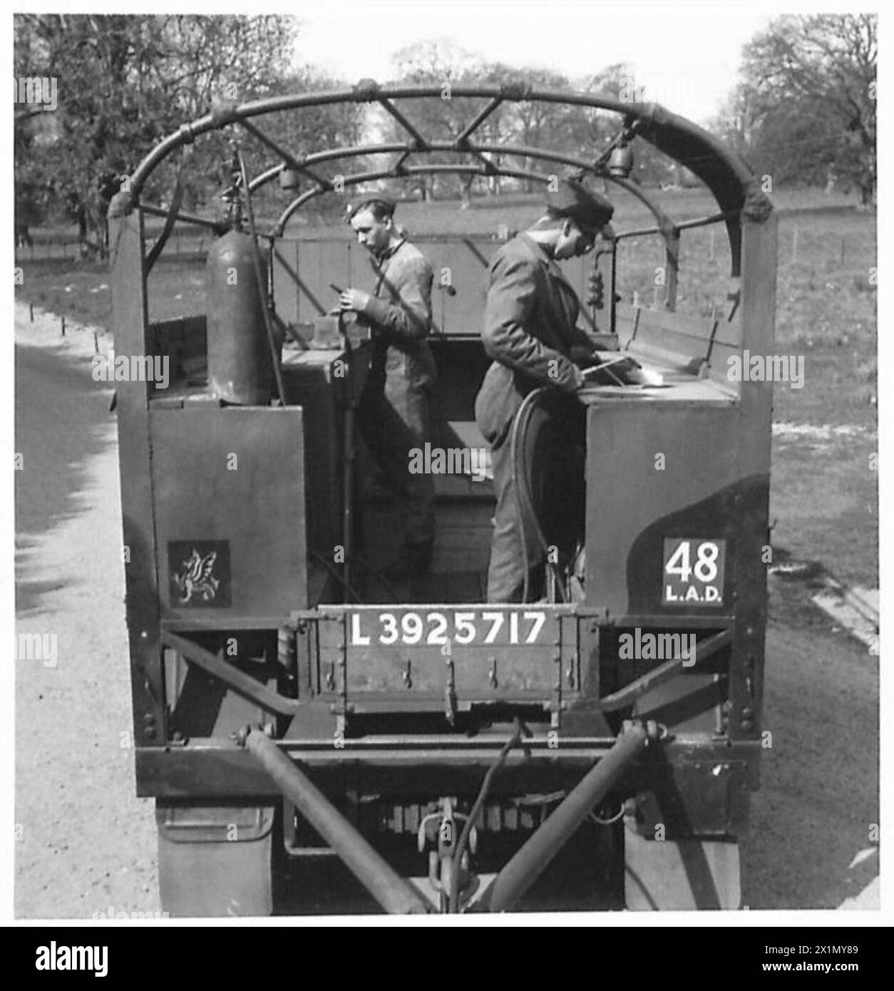 Personnel perform maintenance and repair work on a Crossley breakdown ...