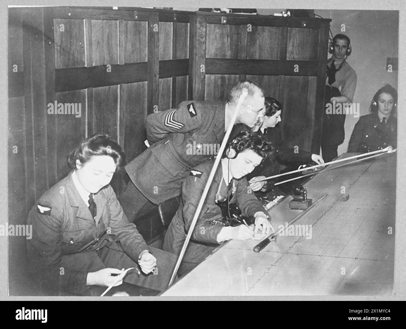 Women of the W.A.A.F. are working as plotters in the Operations Room at ...