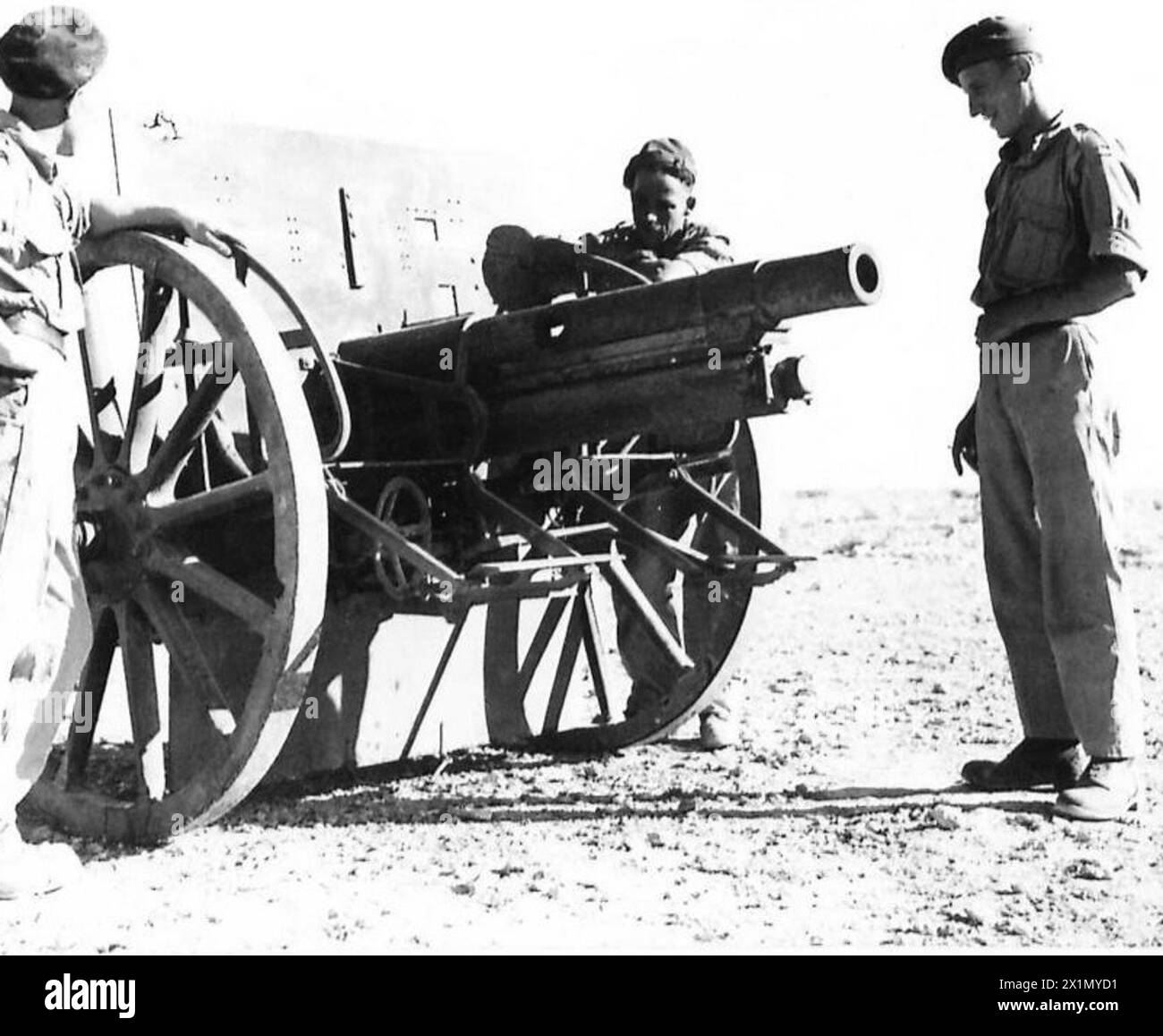 ACTIVITY IN THE WESTERN DESERT - A captured Italian field gun showing ...
