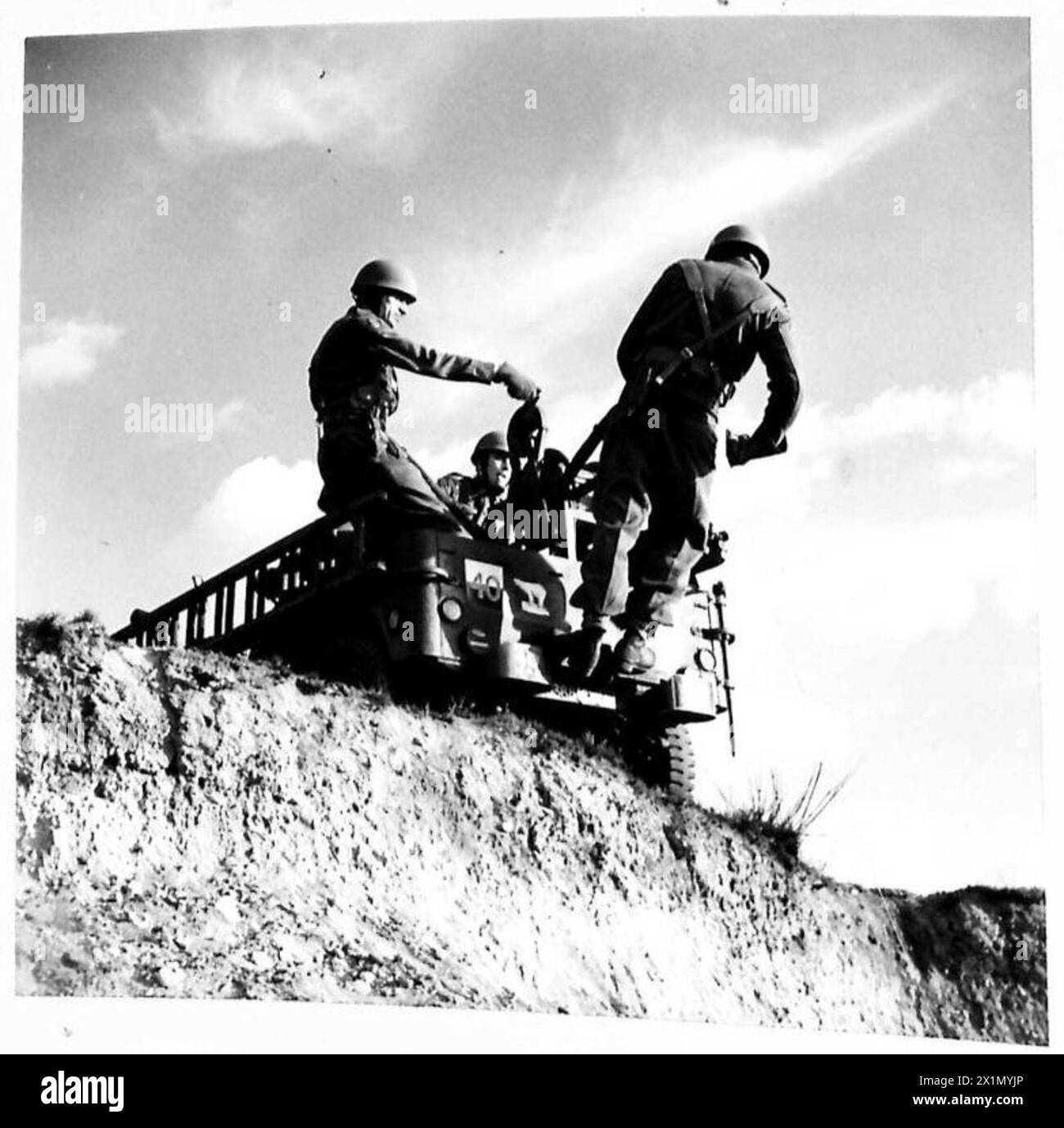 A Jeep is laying cable cross-country, demonstrating its ability to ...