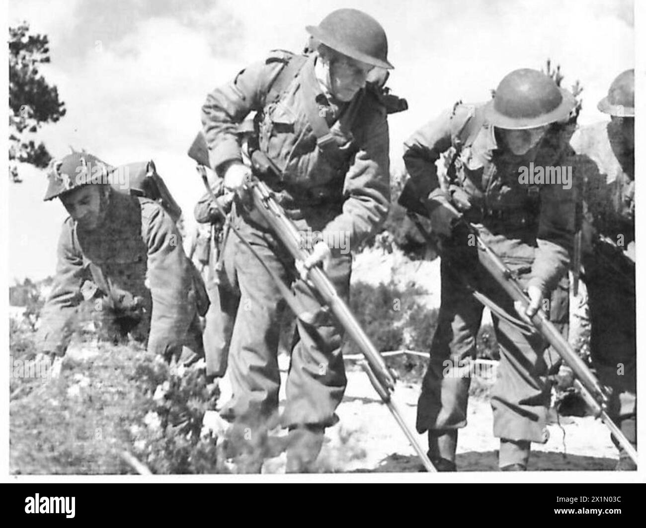 MINE DETECTING BY INFANTRY AND ENGINEERS - Soldiers using their rifles ...
