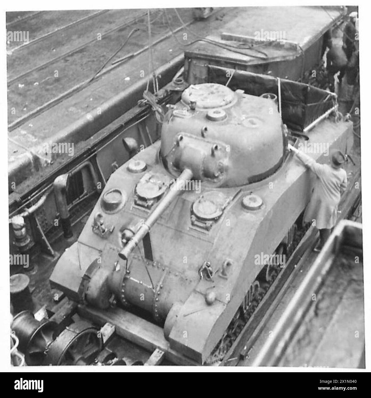American Sherman tanks are securely packed in wooden crates and sealed ...