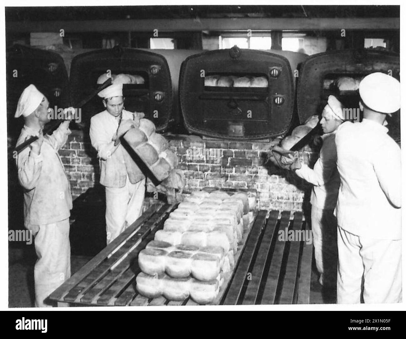 BAKING THE ARMY'S BREAD - Bread coming out of the ovens, British Army ...