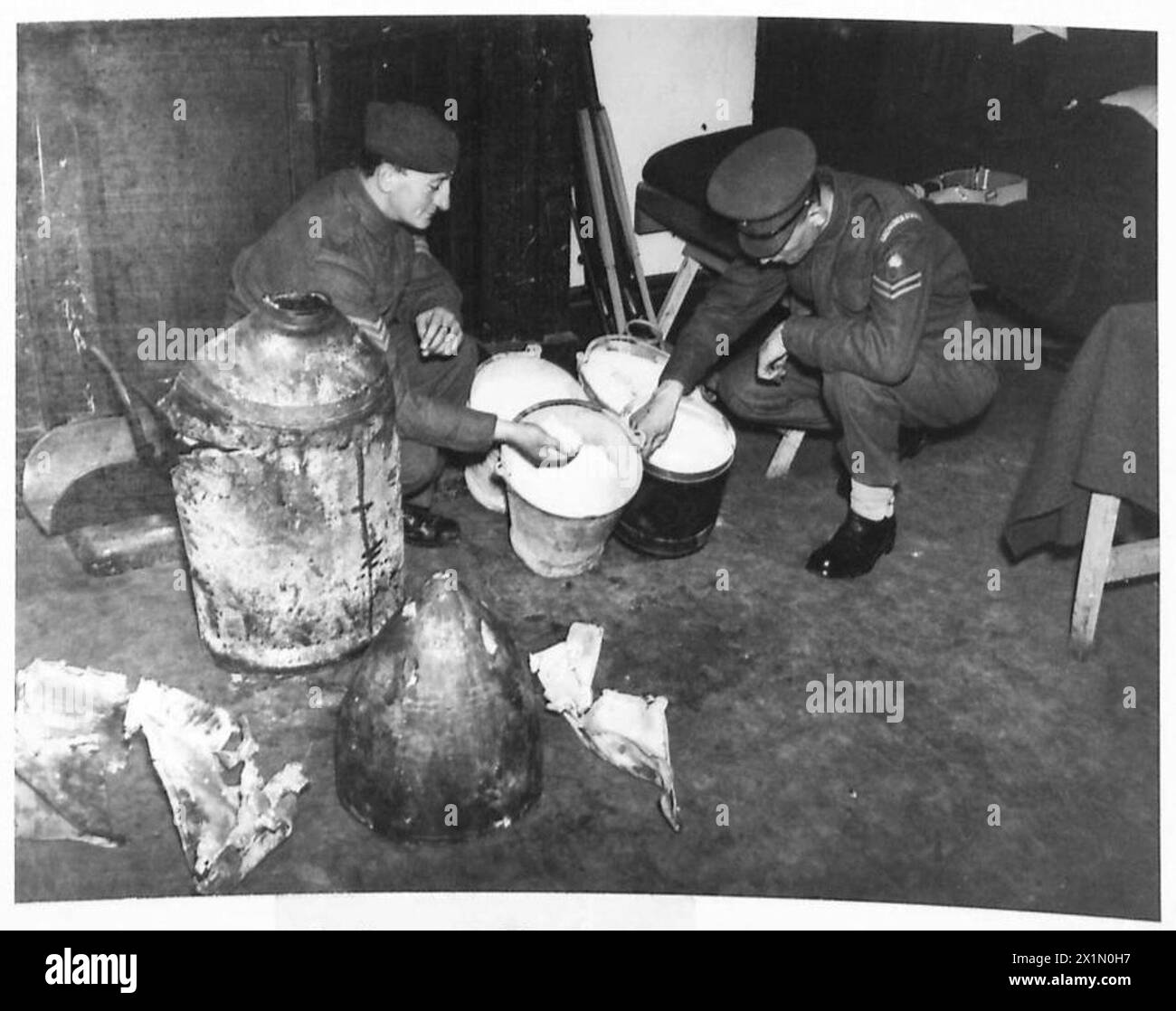 During a German air raid on London, British Army personnel examined the ...