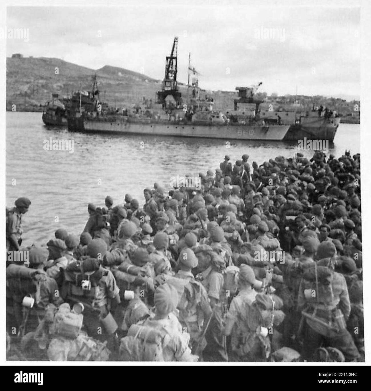 Landing craft carrying British troops approach the dockside in Athens ...