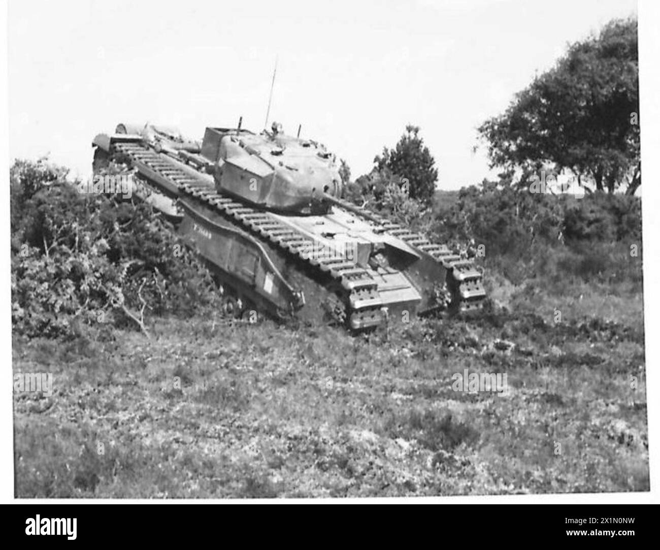 ANCIENT AND MODERN - Churchill Mk.II tank crashing through a hedge ...