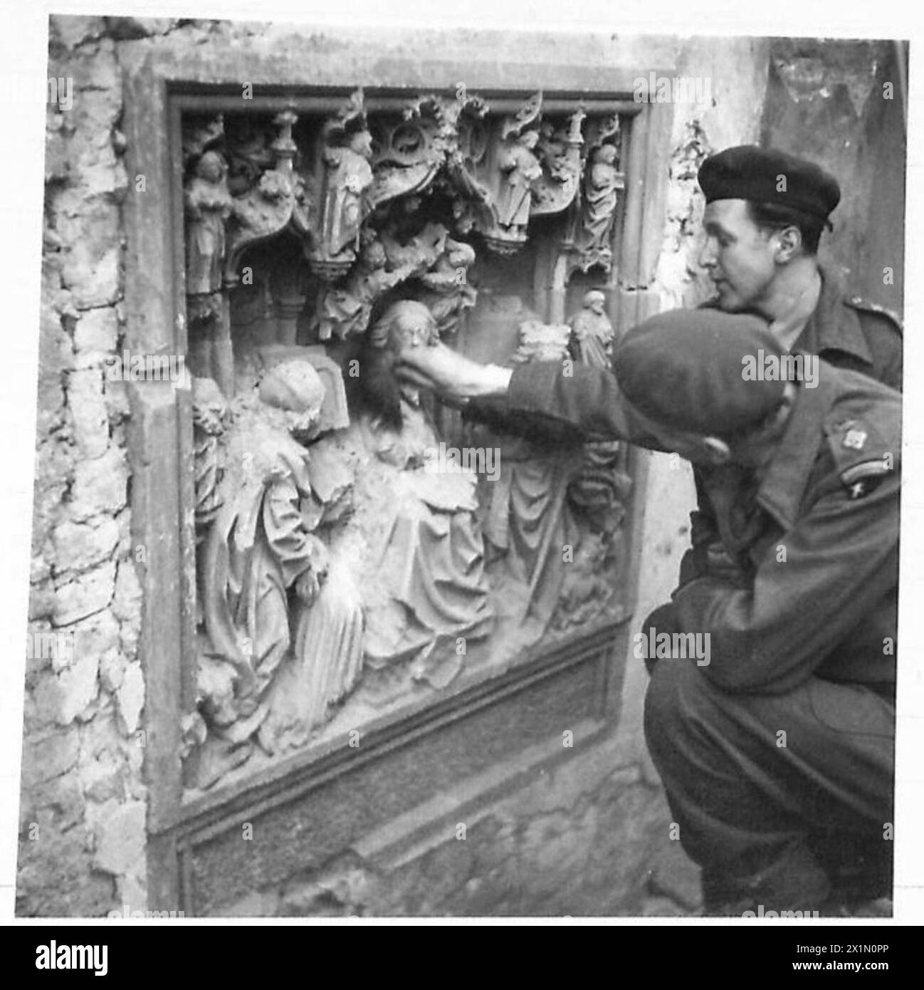 SALVAGING HISTORY - Lt-Col Webb examining one of the damaged base ...