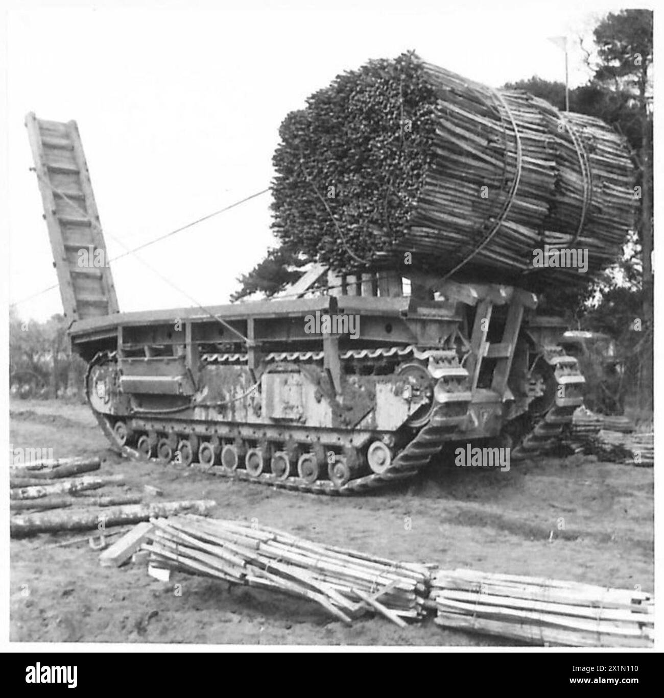 A Churchill tank of the 79th Armoured Division carries fascines during ...