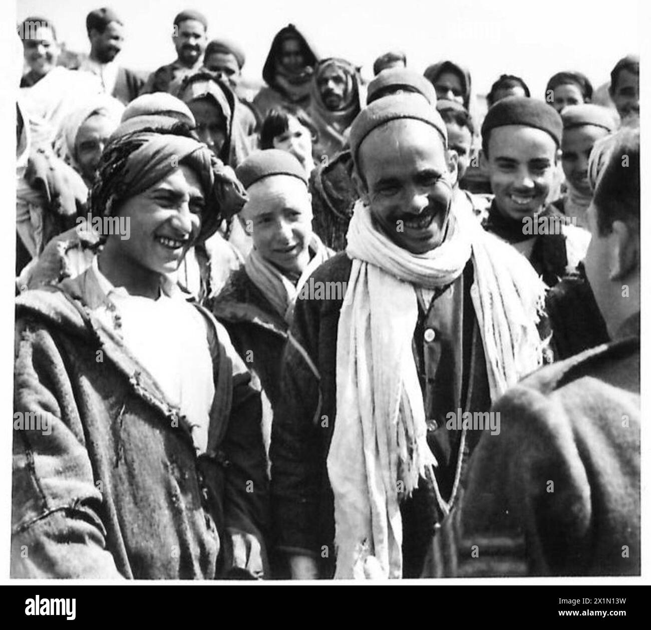 ARMY NEWS SERVICE FOR NORTH AFRICAN ARABS - Sgt. Sang explaining points ...