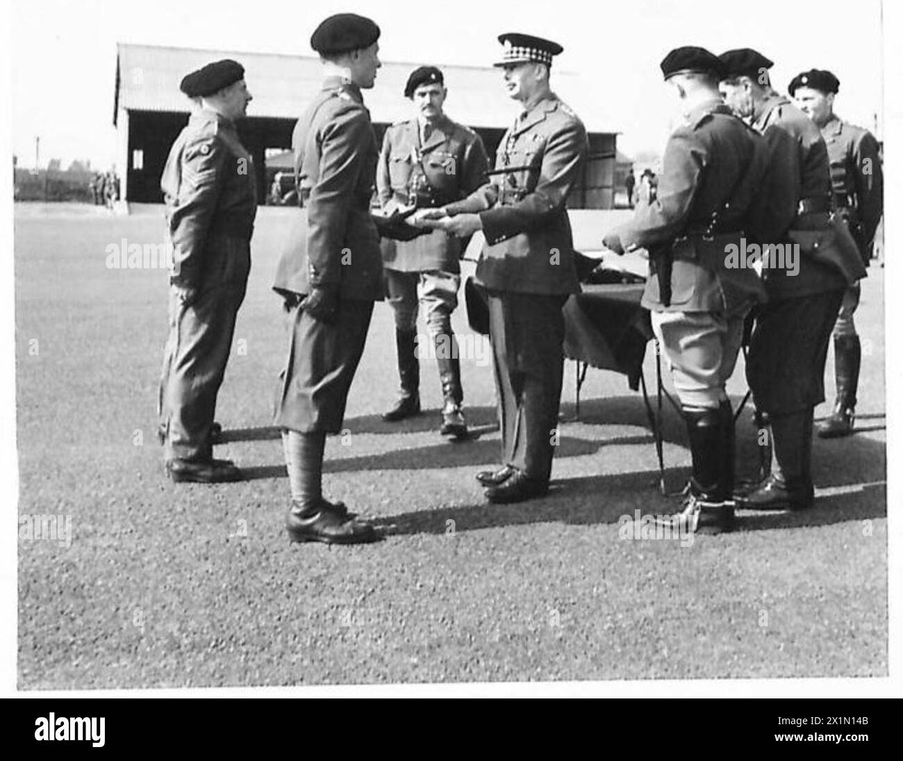 HRH the Duke of Gloucester presents pennants to troop leaders of the ...