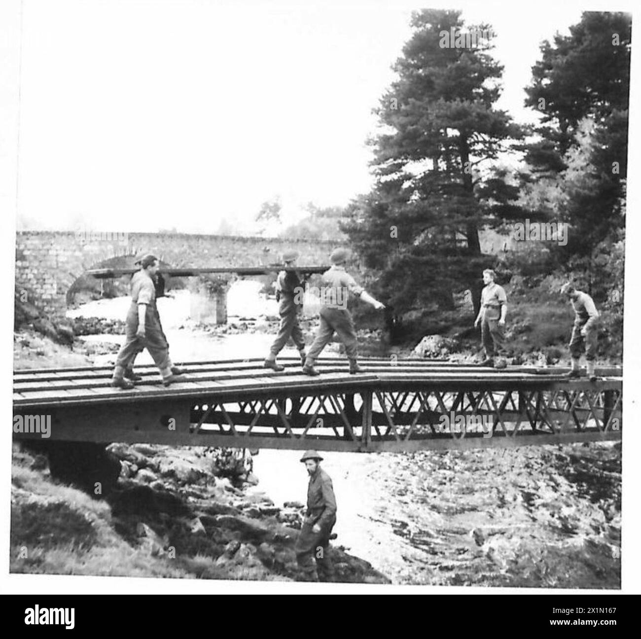 PORTABLE BRIDGE CONSTRUCTION - The bridge nearing completion spans a ...