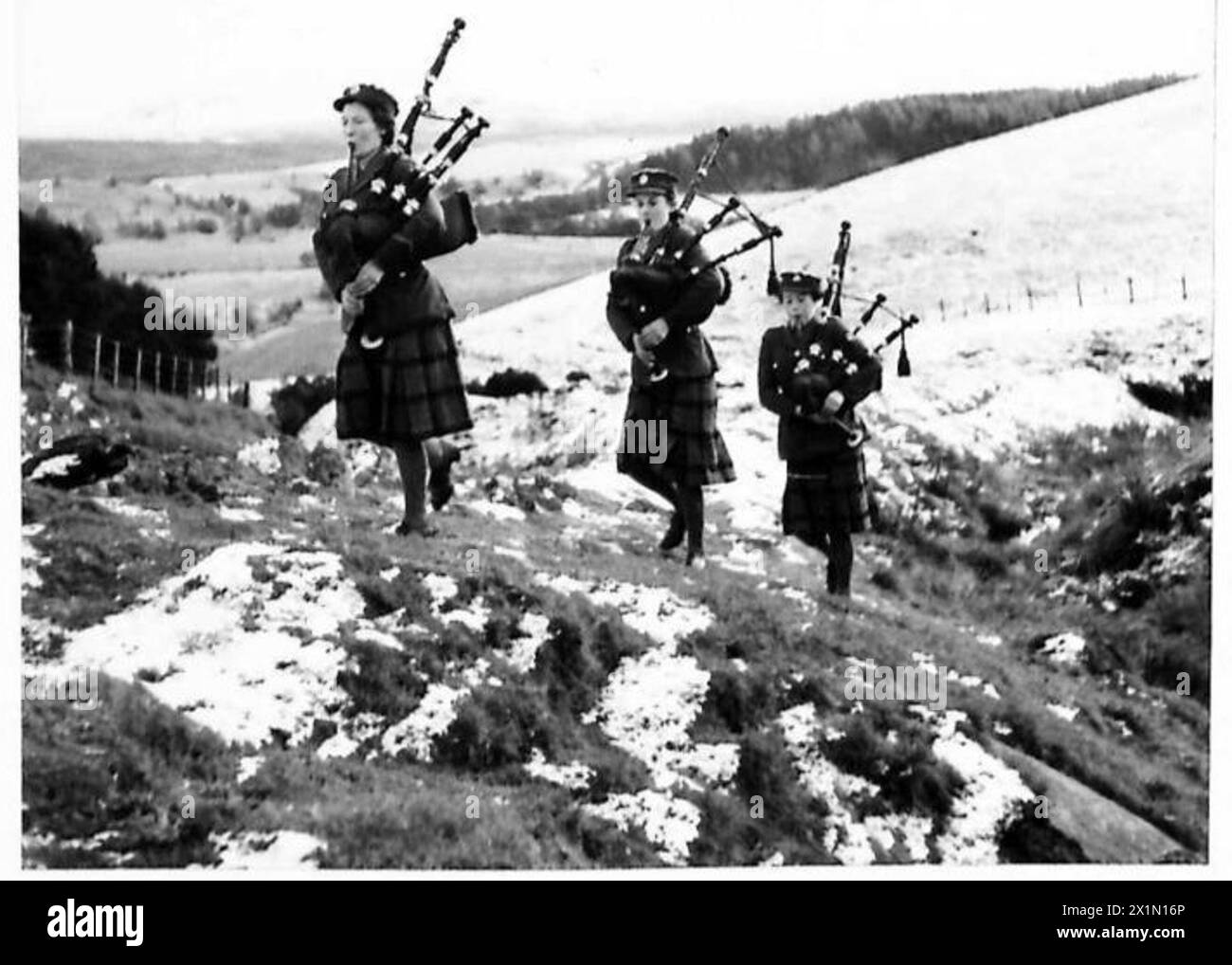 Three ATS members play bagpipes at a training centre in Scotland ...