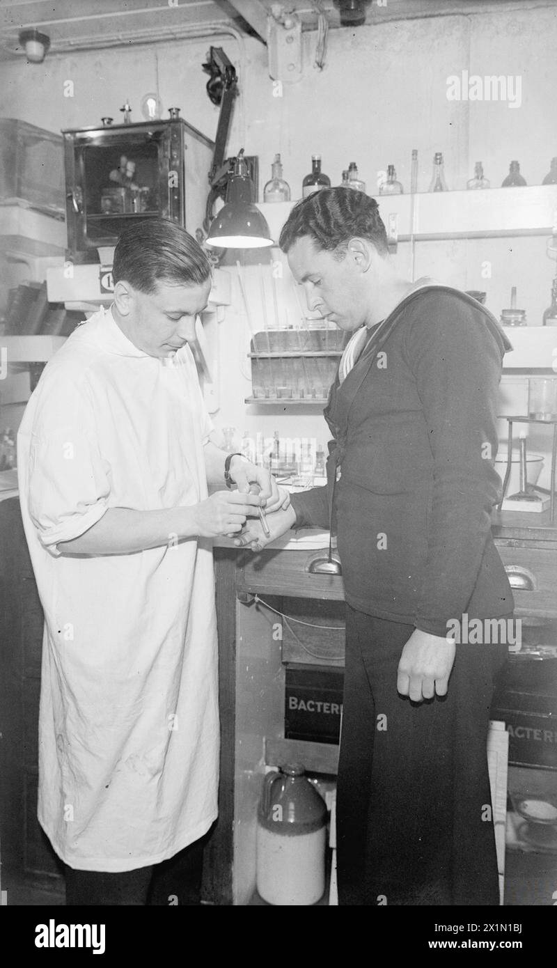 BLOOD TRANSFUSION ABOARD A NAVAL HOSPITAL SHIP. 15 JULY 1943, SCAPA ...
