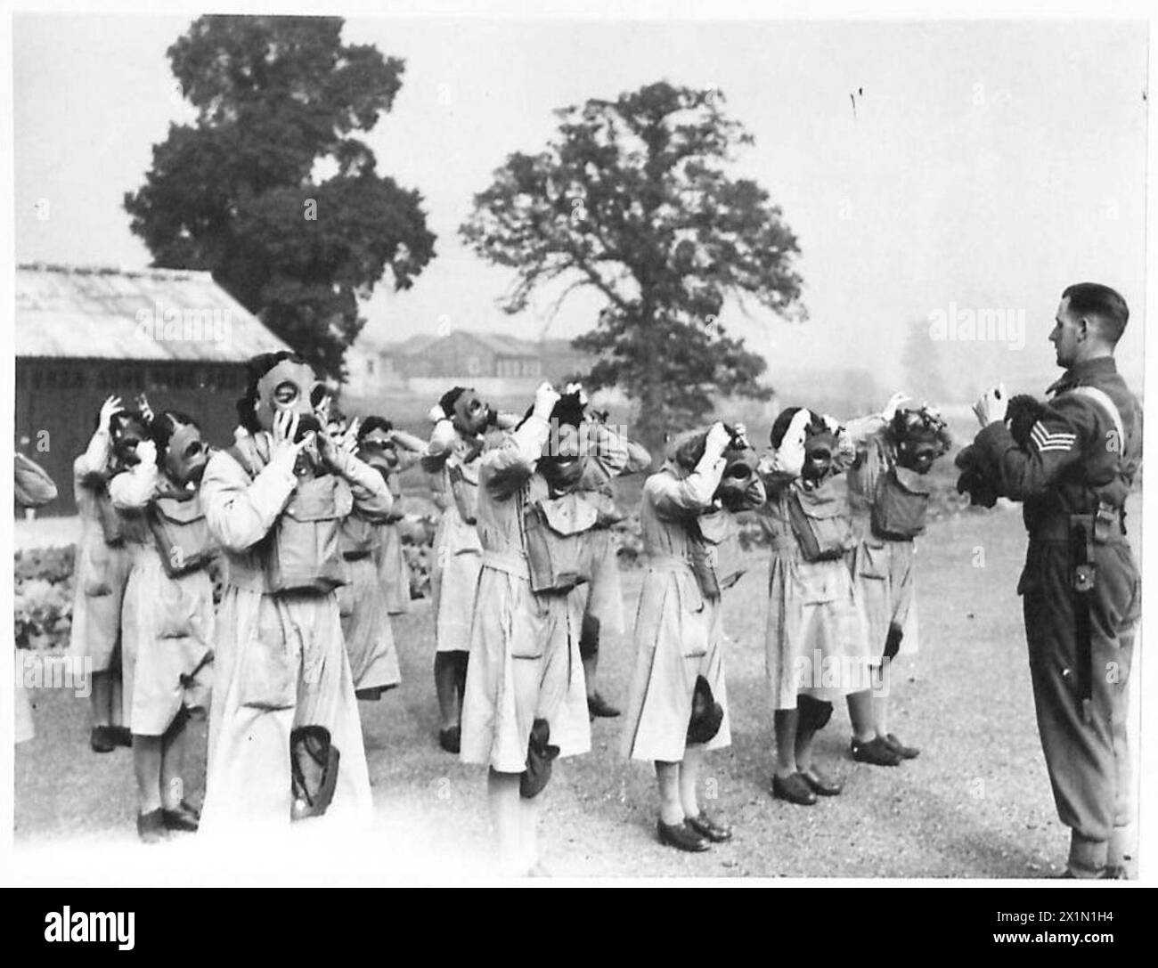 A.T.S. TRAINING - Gas mask drill, an Army sergeant shows the correct ... A.T.S. TRAINING - Gas mask drill, an Army sergeant shows the correct ...