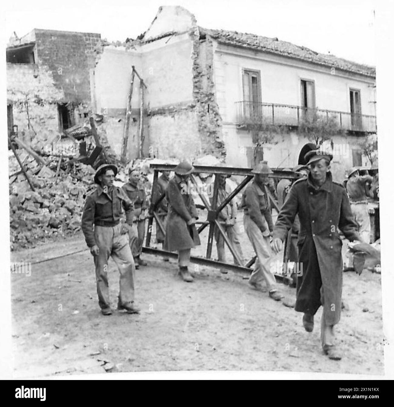 Royal Engineers sappers carry a steel panel to start construction of a ...