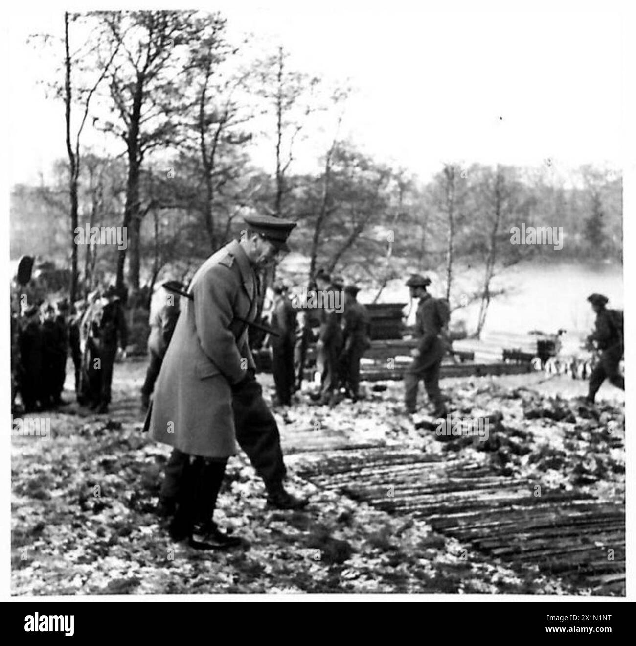 Troops demonstrate disembarking from cargo nets into Landing Craft ...