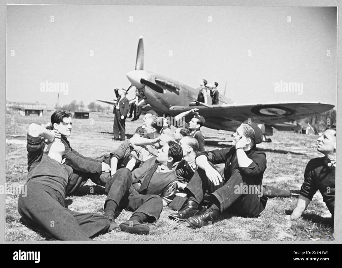 RAF Fighter Command ground crews observe the return of Spitfire ...