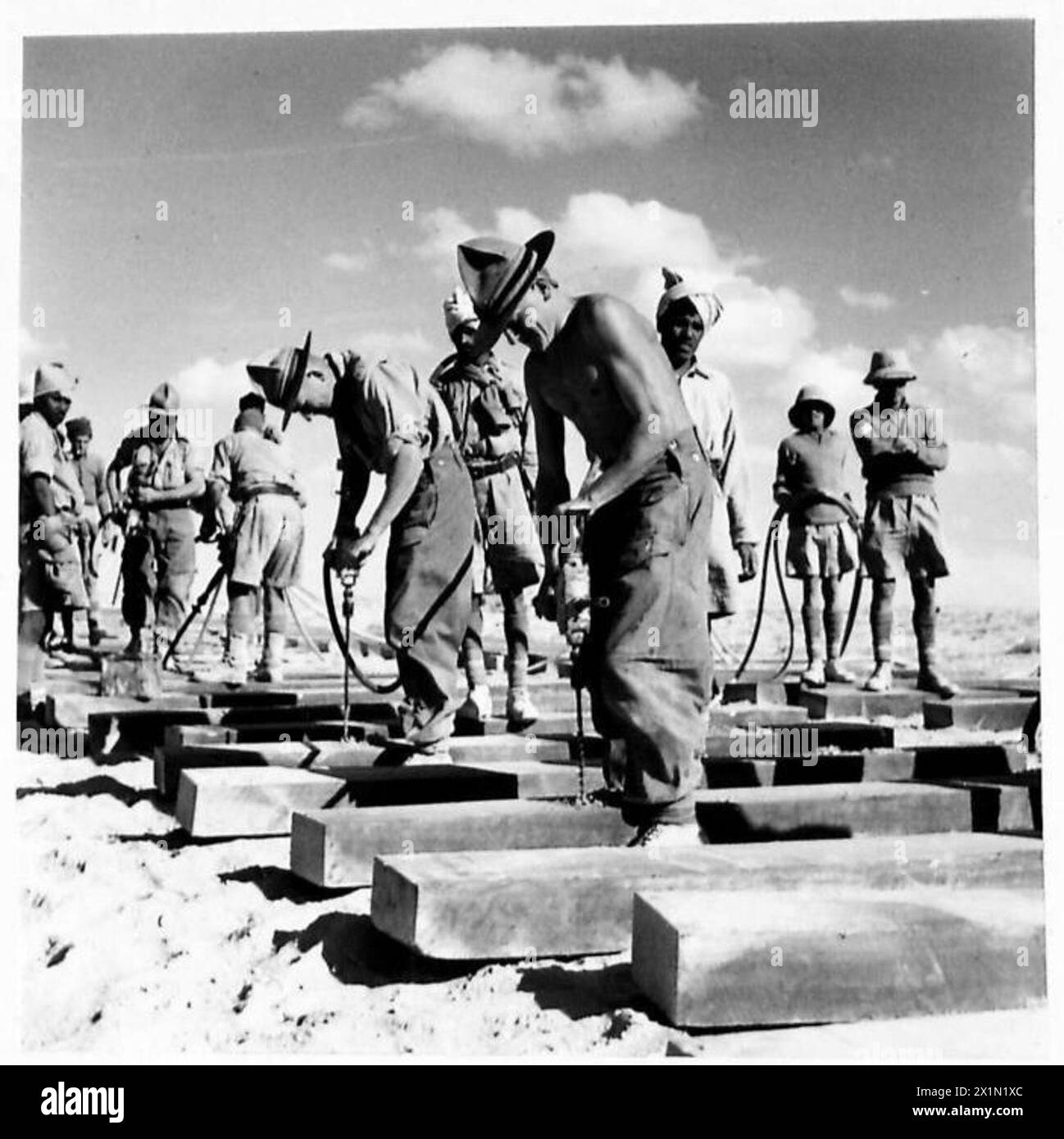 British Army personnel construct a railway in the western desert ...