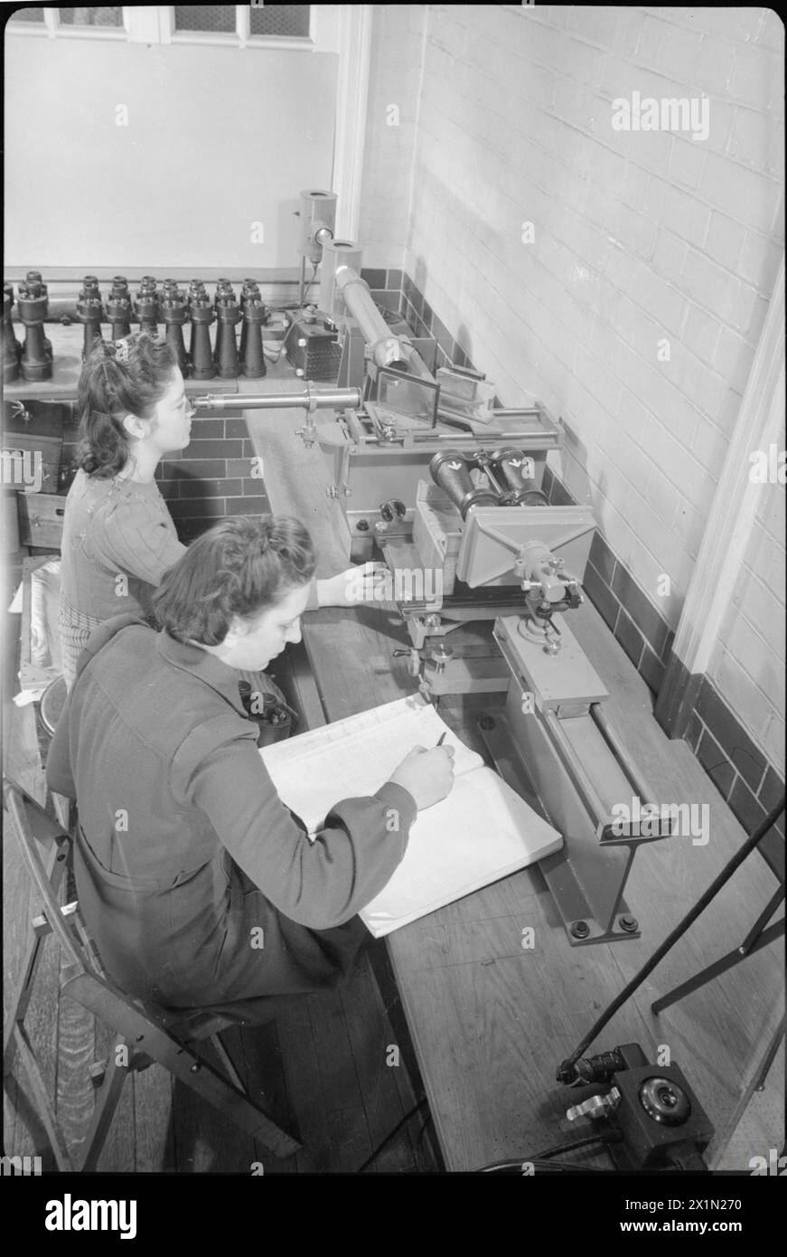 Two female scientists in the Optics Section of the NPL Light Division ...