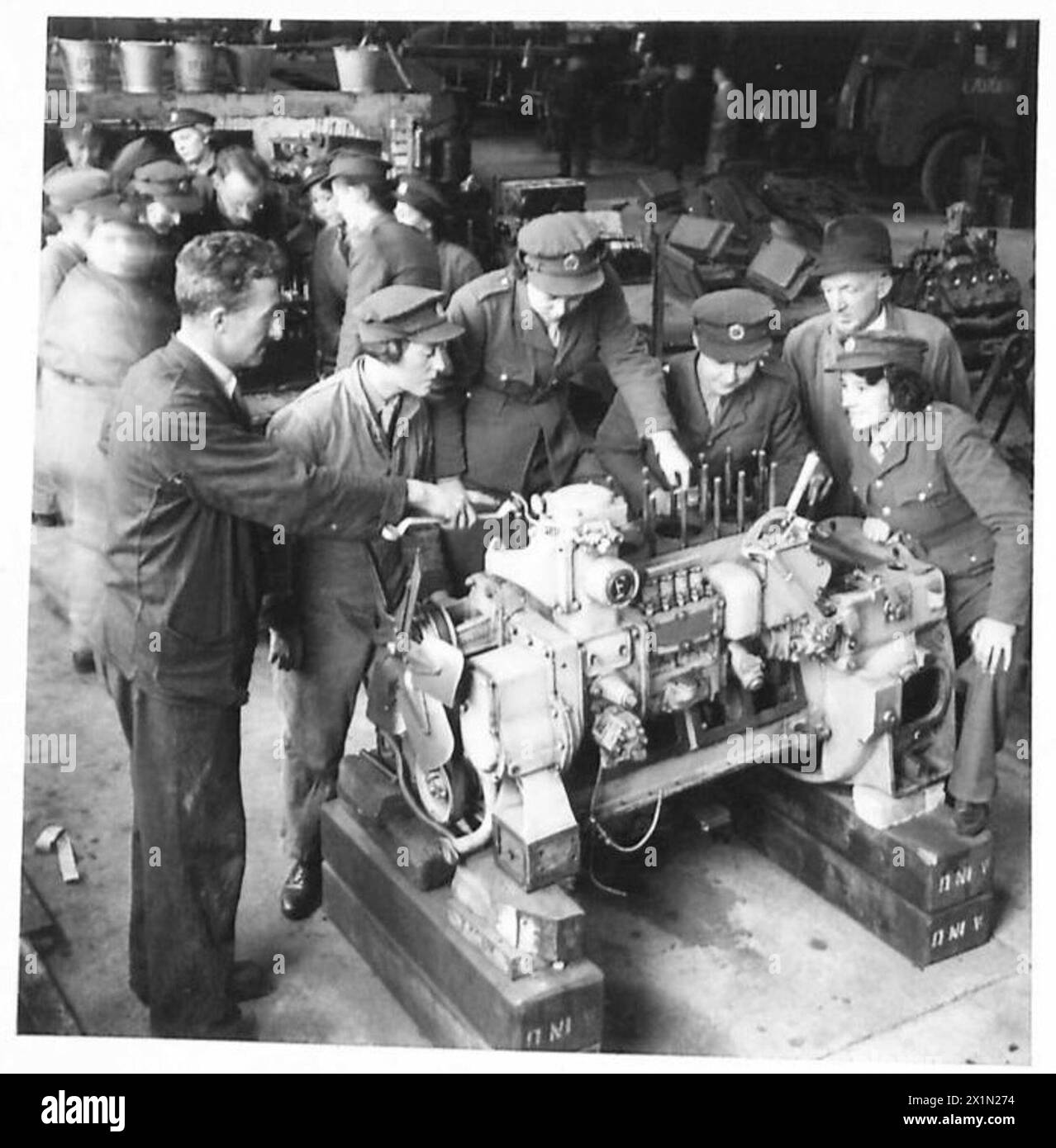 ATS personnel learning engine mechanics from a workshop engineer at an ...
